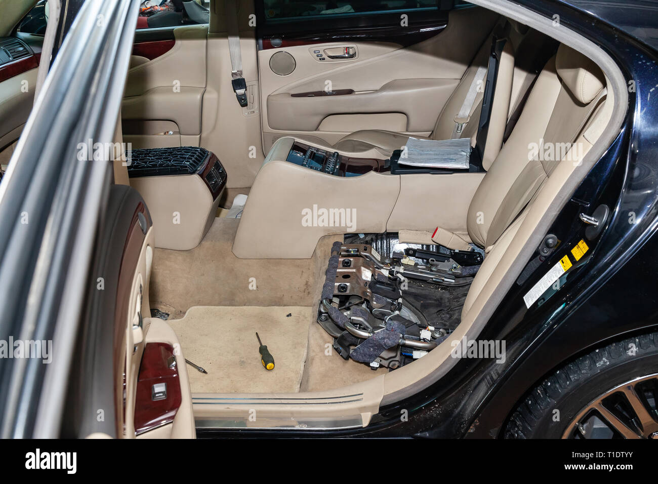 The interior of the car inside is partly disassembled, rear seats are ...