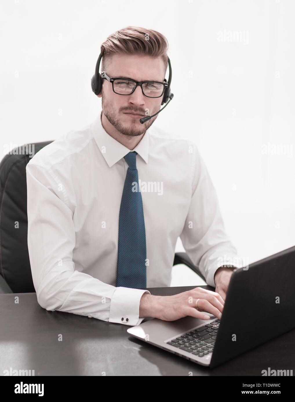 business center employee working on a laptop Stock Photo - Alamy
