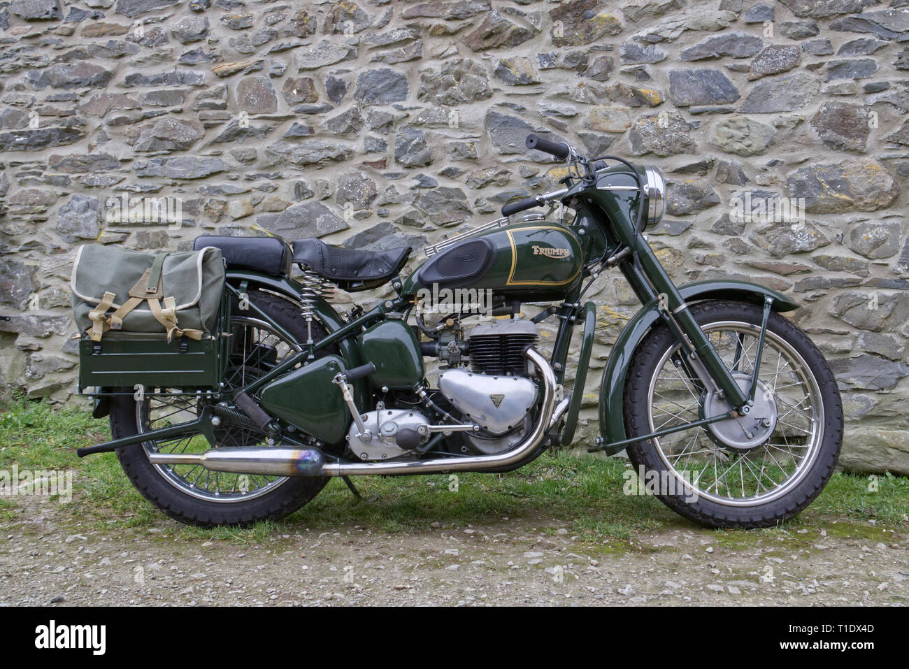 Classic Triumph TRW 500cc Military motorcycle parked by a stone built ...
