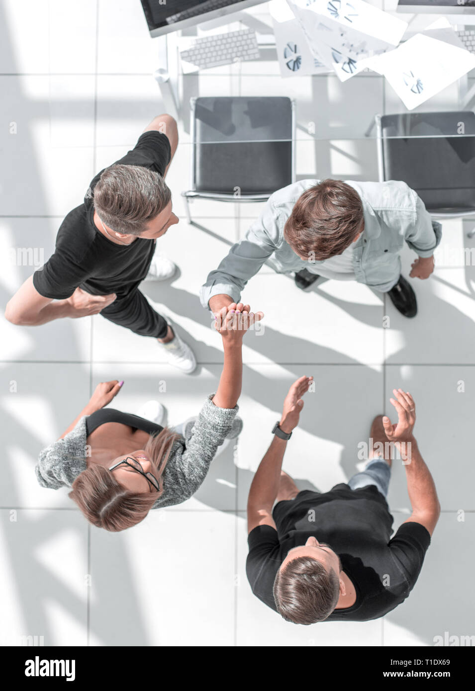 Young business people before starting work in their office Stock Photo ...