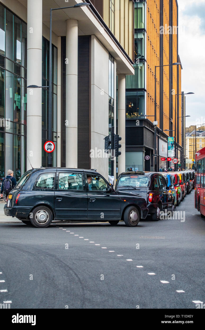 Long row of waiting Taxis in a queue for King's Cross Railway Station ...