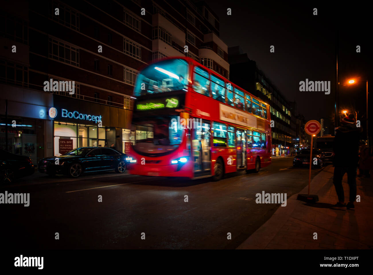 Blurred image taken at night of one of the late night last London buses ...