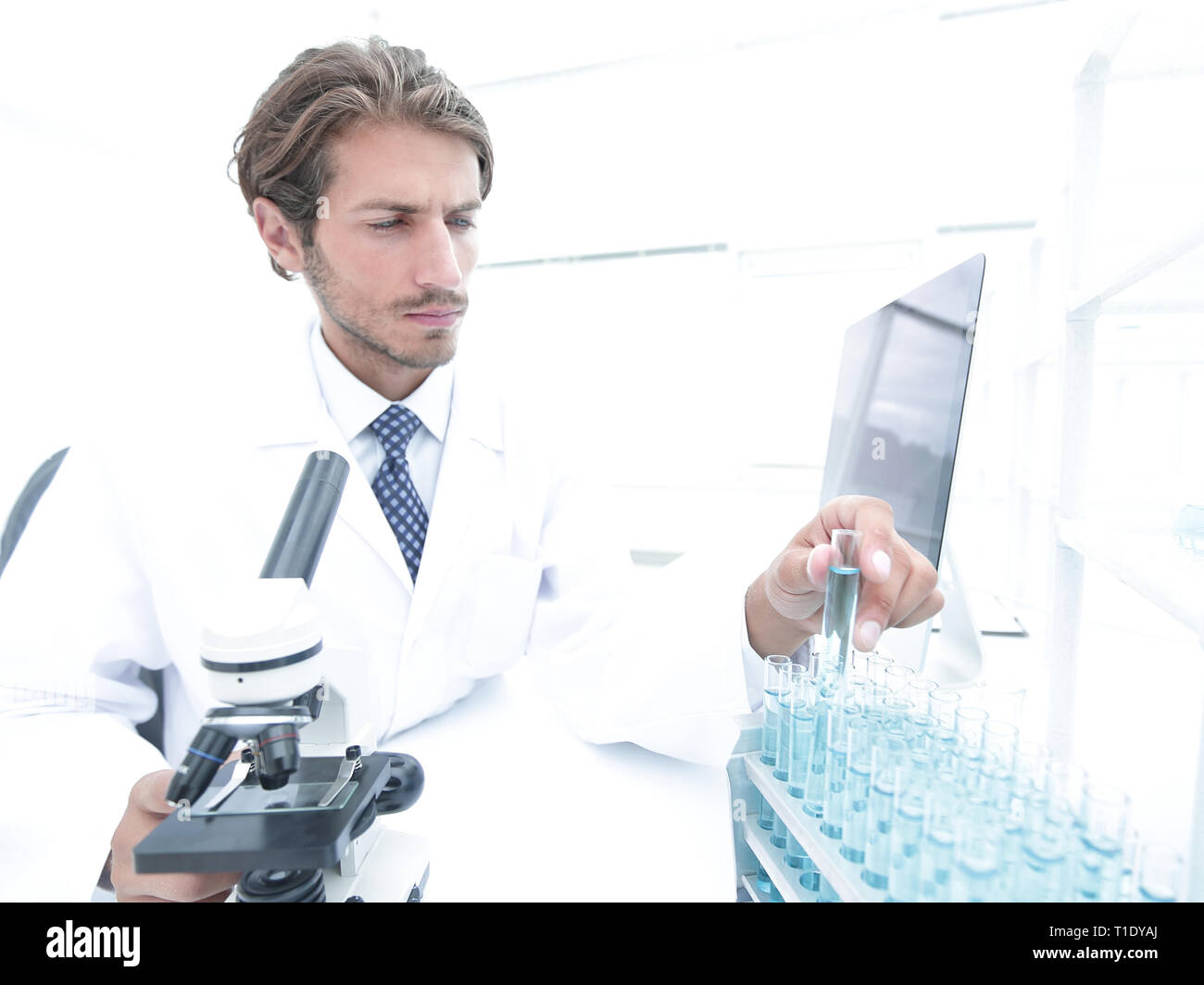 laboratory scientist working in a laboratory with a microscope Stock ...