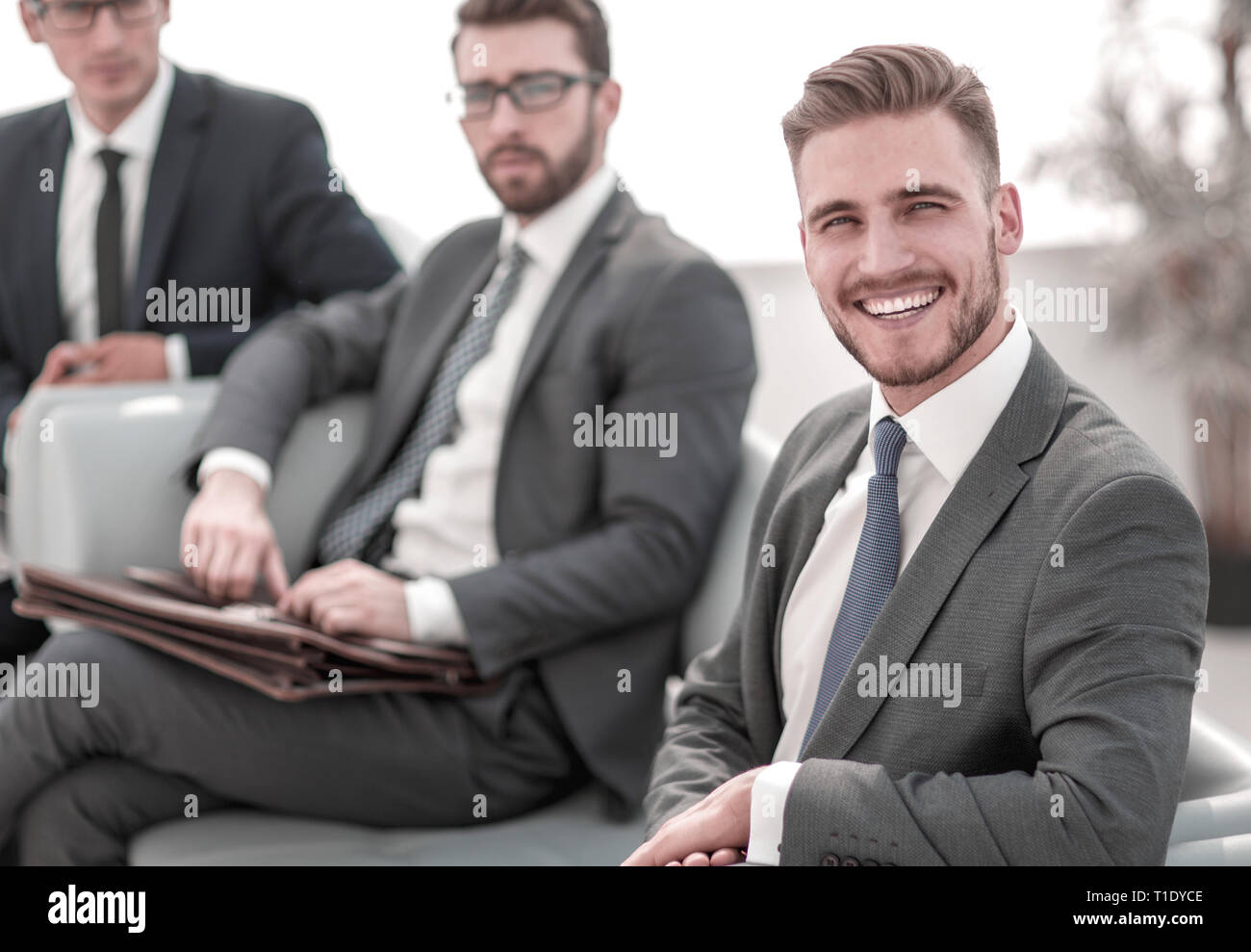 group of business people sitting in the office reception Stock Photo ...