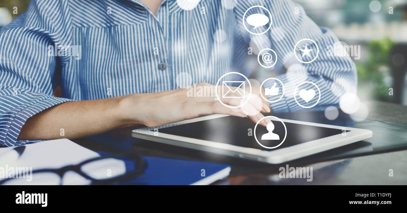 Girl touching tablet screen with virtual icons Stock Photo - Alamy