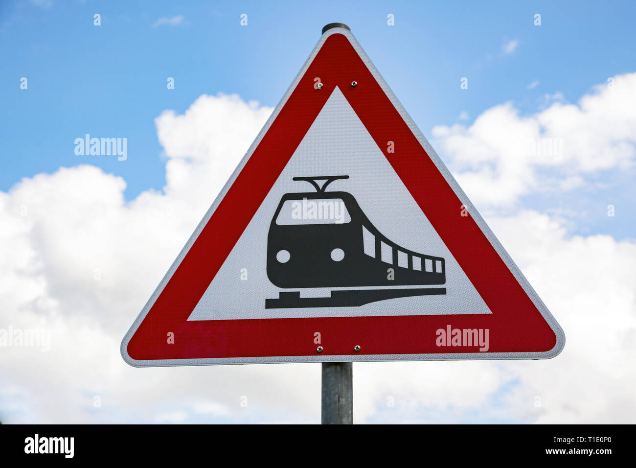 Detail from Attention Tram Sign on blue clouds sky Background Stock ...