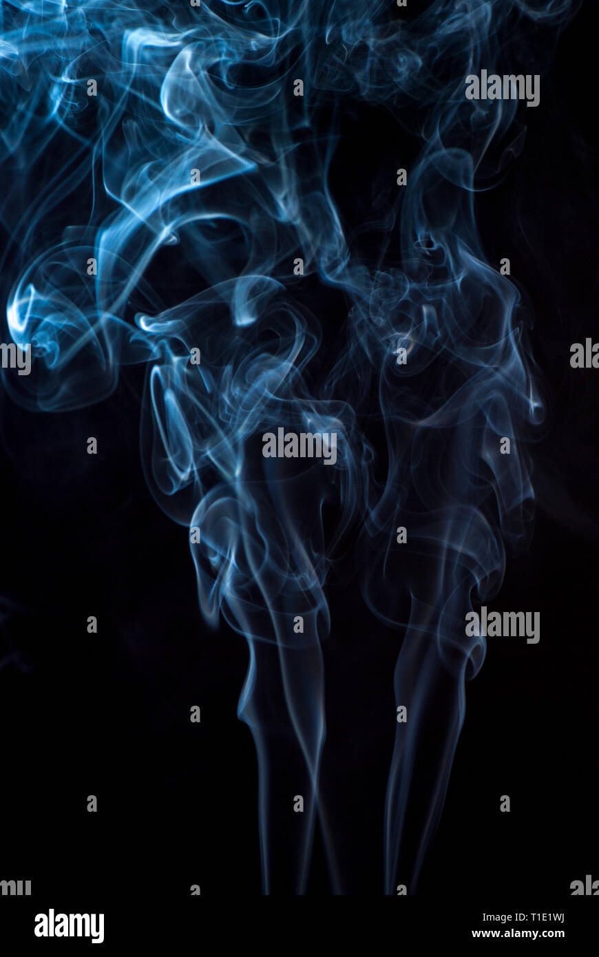 Beautiful smoke on the black background - macro photo Stock Photo - Alamy