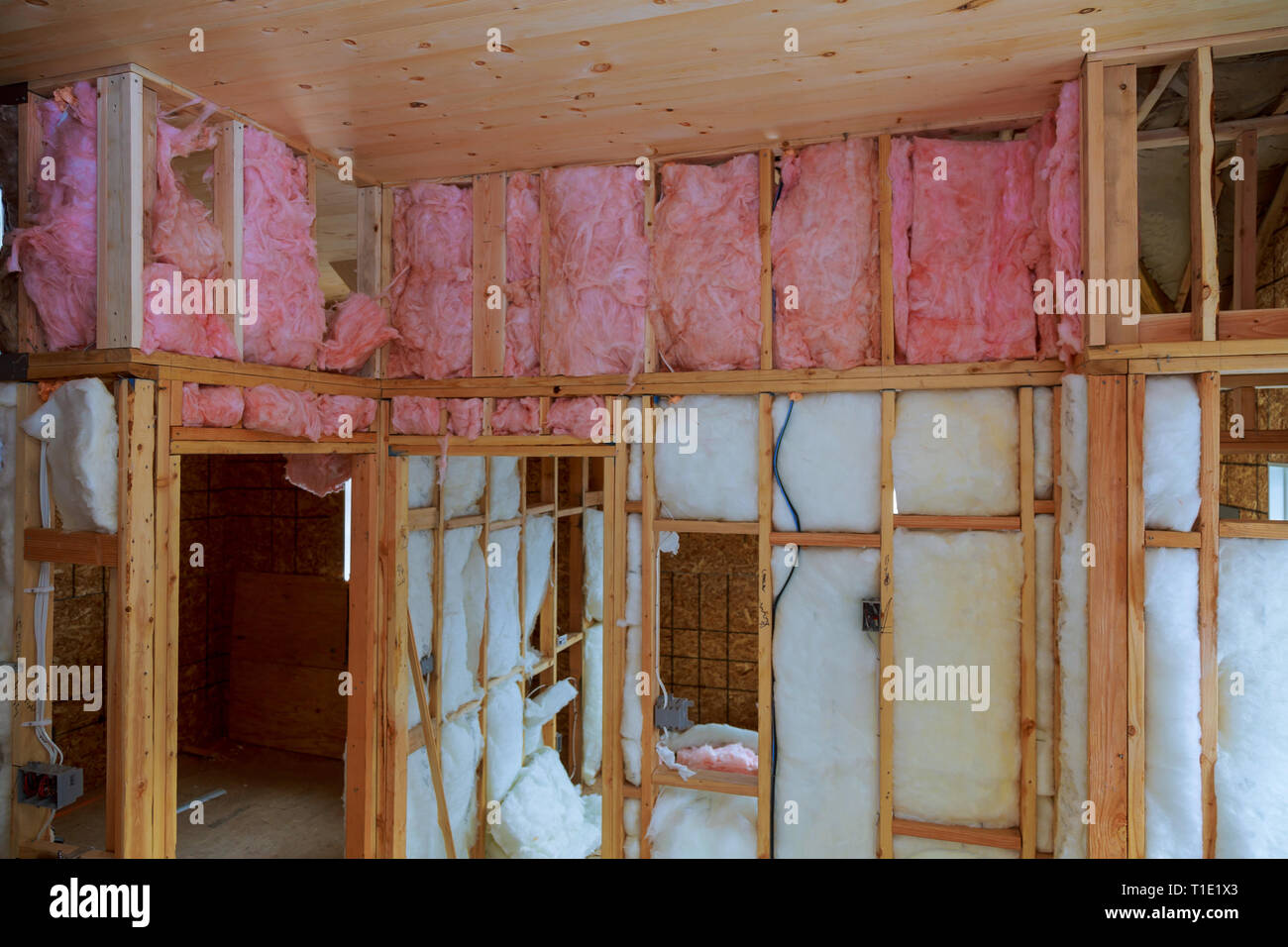 Heat isolation in a new house with mineral wool, wood home Stock Photo ...
