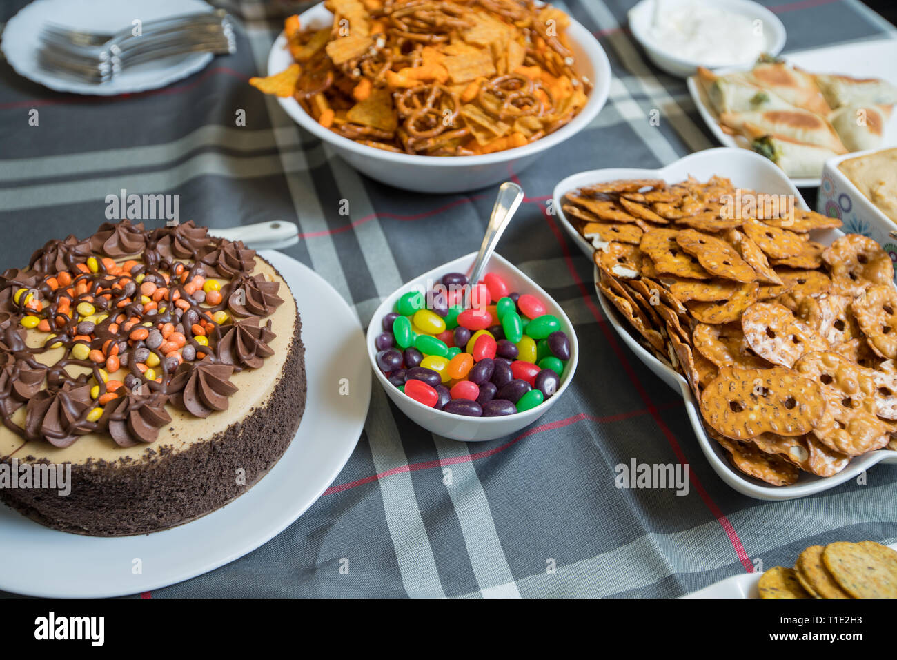 Various candies and snacks on table top, cake and candy Stock Photo - Alamy