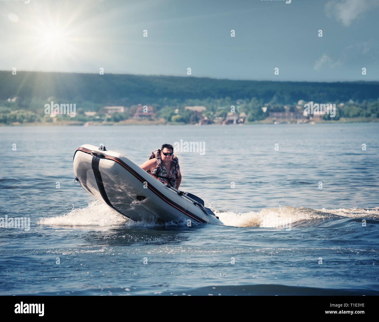 Man driving boat fast hi-res stock photography and images - Alamy