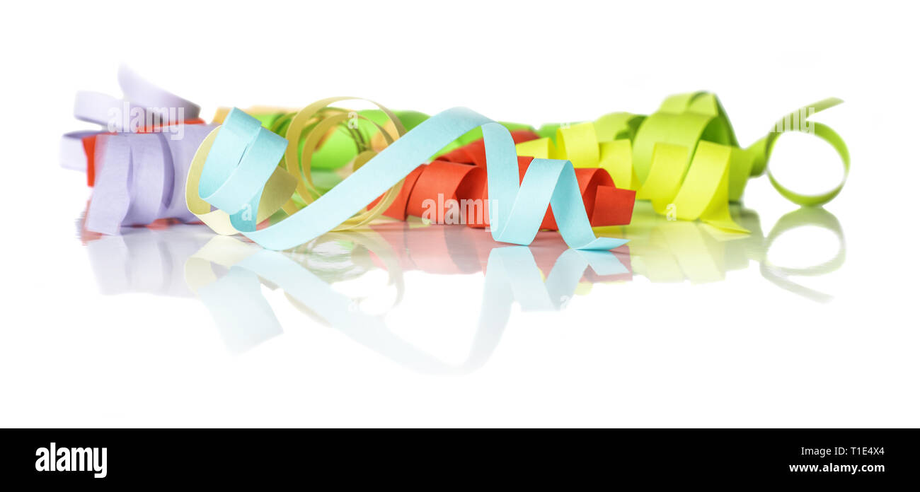 Multicolored paper ribbons twisted into a spiral isolated on a white ...