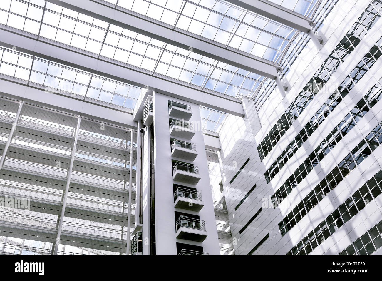 Modern high-tech design of white office building over blue sky. New ...