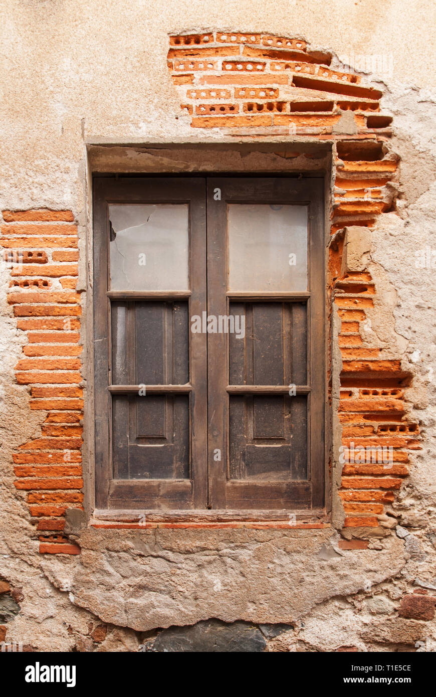 Wooden window in the wall of the ancient building in medieval Old Town ...