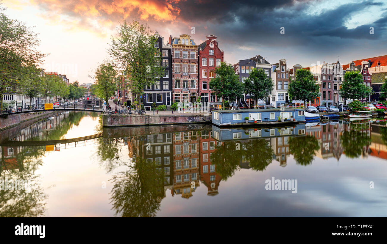 Amsterdam Canal houses at sunset reflections, Netherlands Stock Photo ...