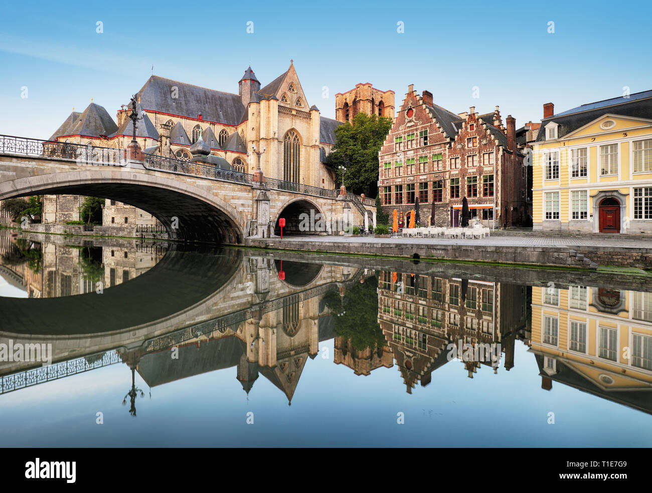 Gent - Medieval cathedral and bridge over a canal in Ghent, Belgium ...