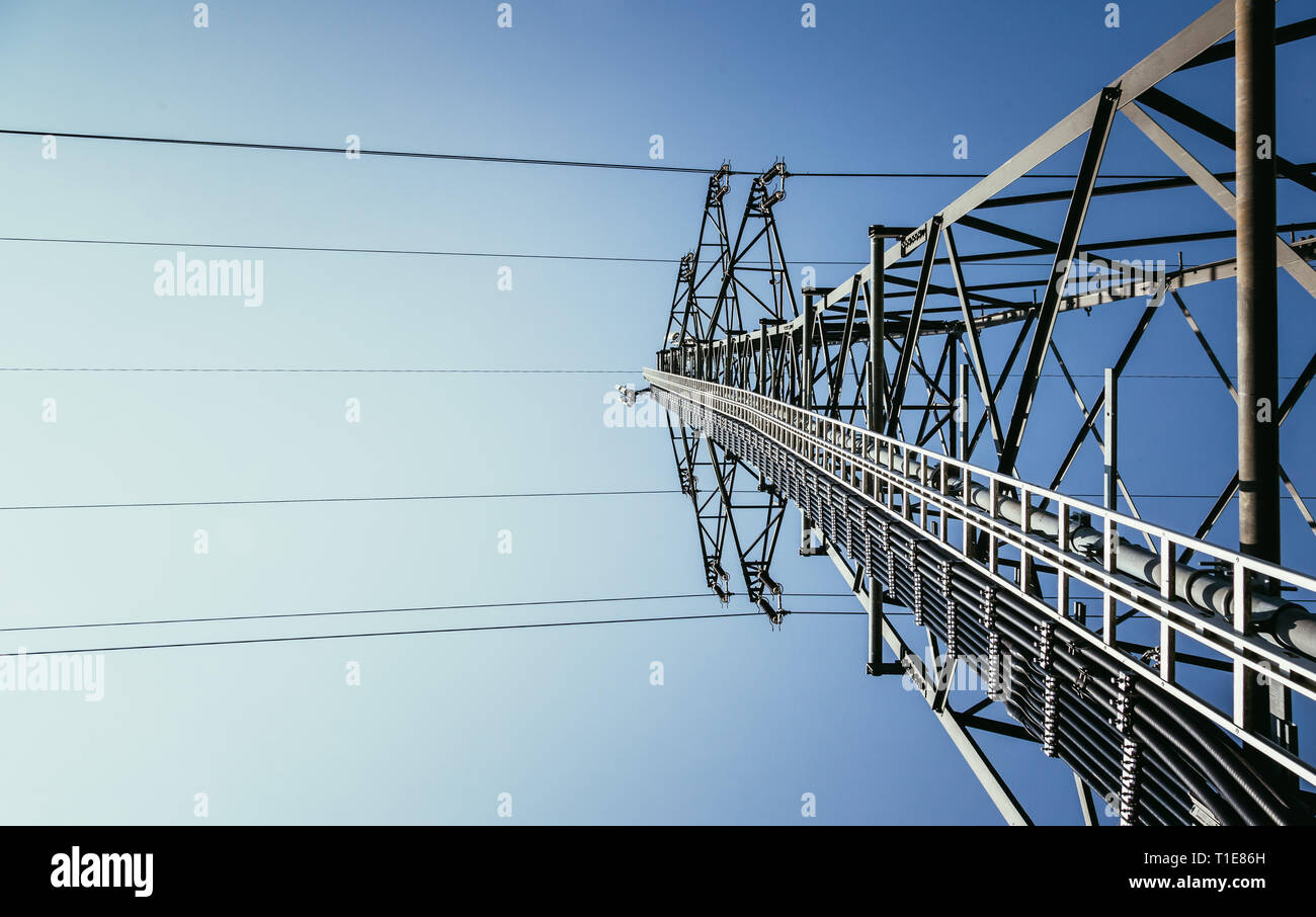 Picture of an electrical tower or pylon, blue sky in the background ...