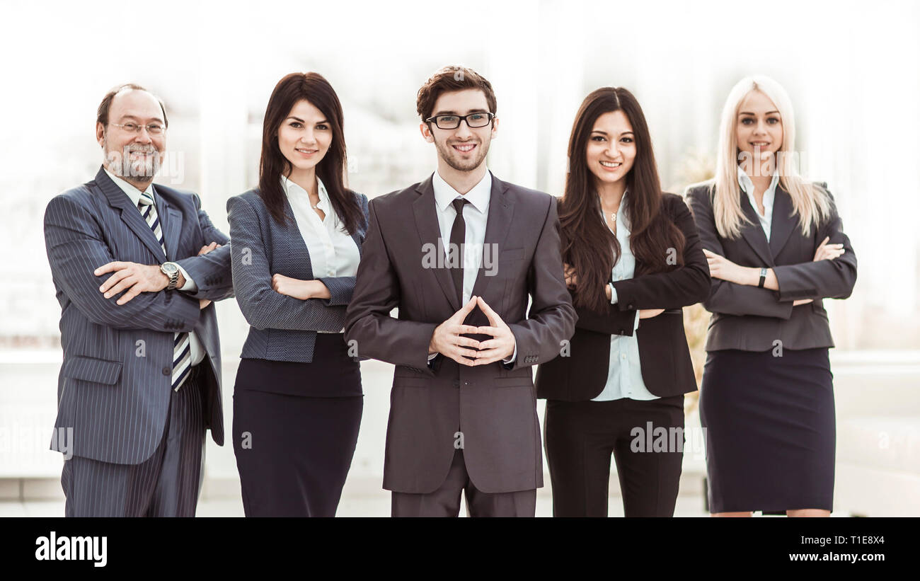 portrait of successful businessman and business team standing together ...