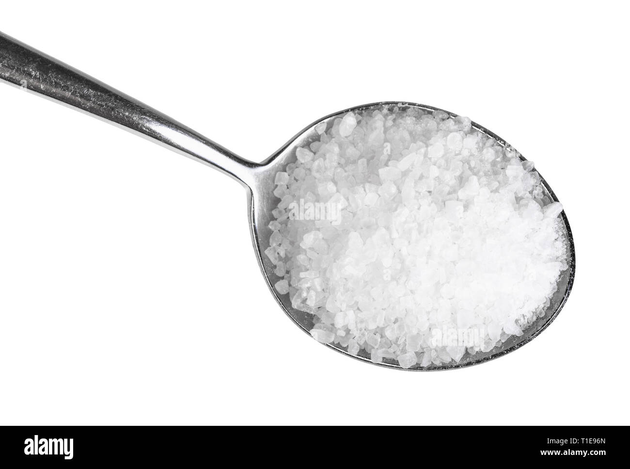 top view of tablespoon with coarse grained Sea Salt close up isolated ...