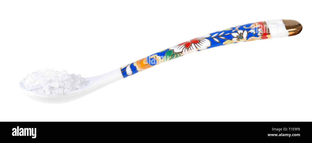 side view of chinese spoon with coarse grained Sea Salt isolated on ...