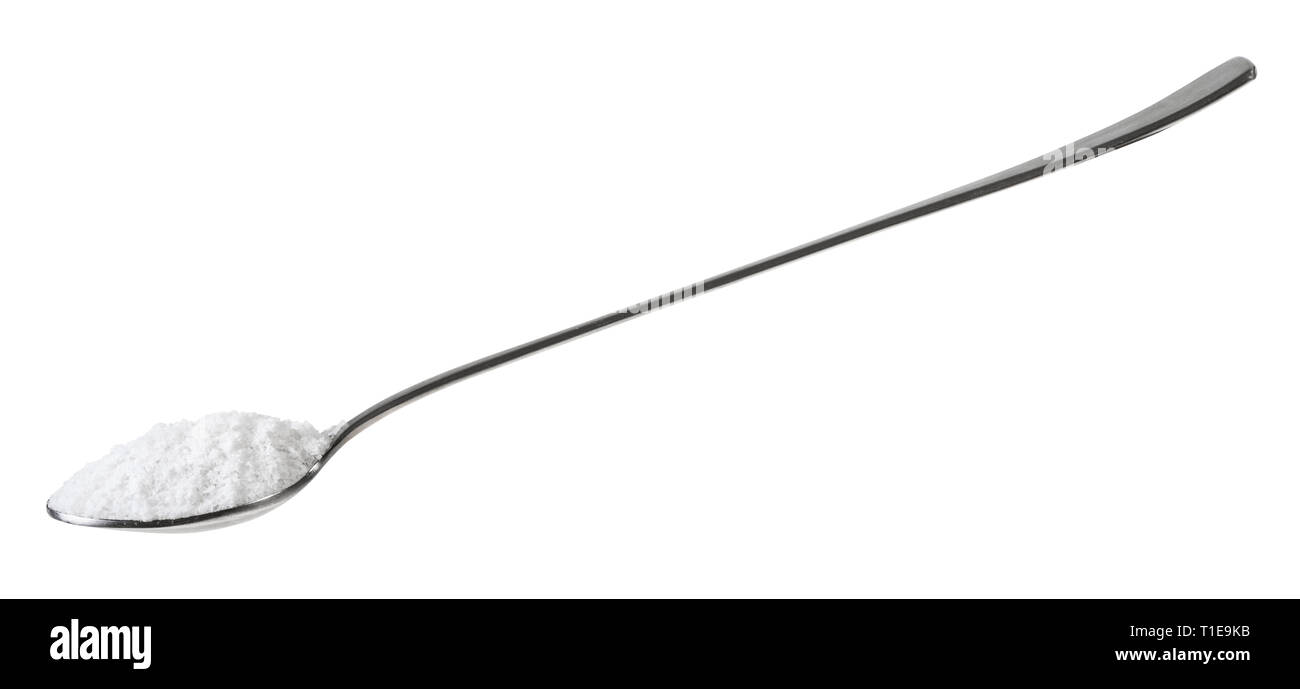 side view of teaspoon with grained Rock Salt isolated on white ...