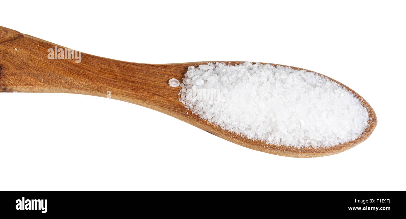 wooden salt spoon with grained Rock Salt close up isolated on white ...