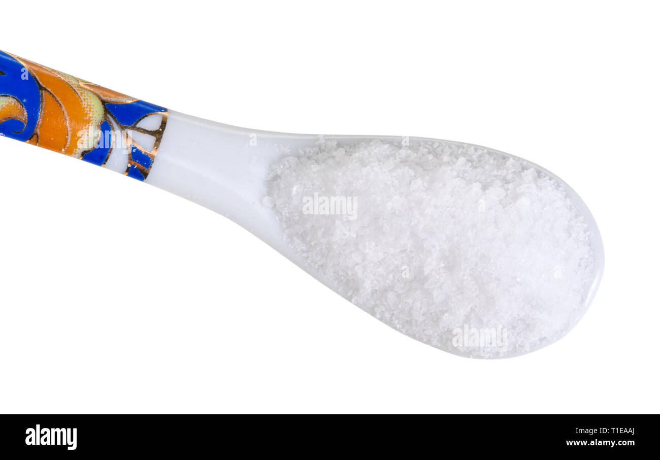 top view of chinese spoon with fine ground Sea Salt close up isolated ...