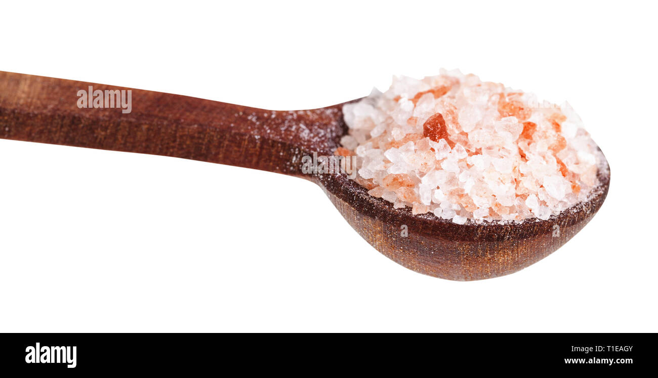 wooden salt spoon with pink Himalayan Salt close up isolated on white ...