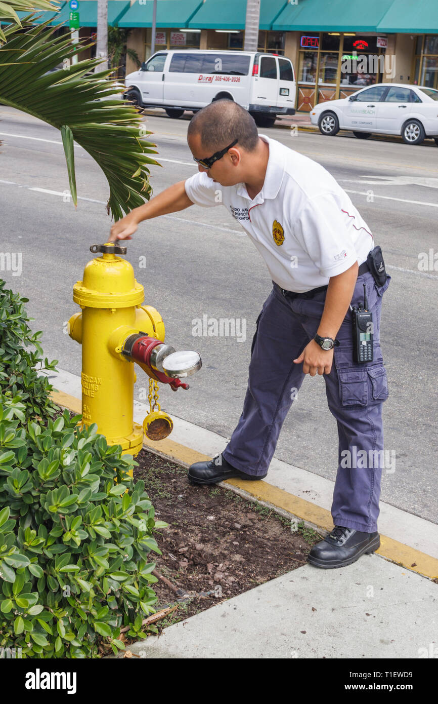 Man water from fire hydrant hi-res stock photography and images - Alamy