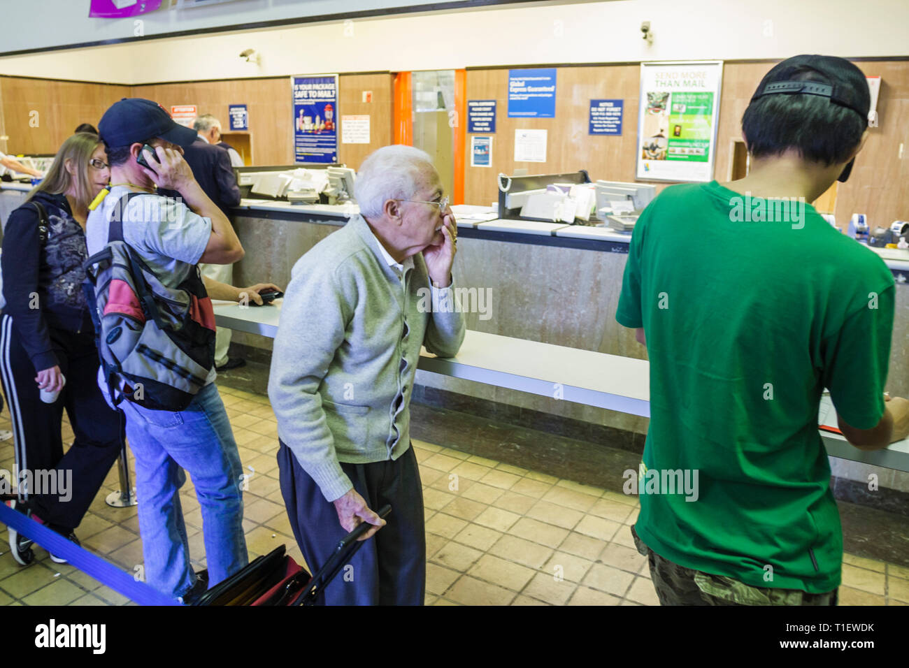 Old woman at post office counter hi-res stock photography and images ...
