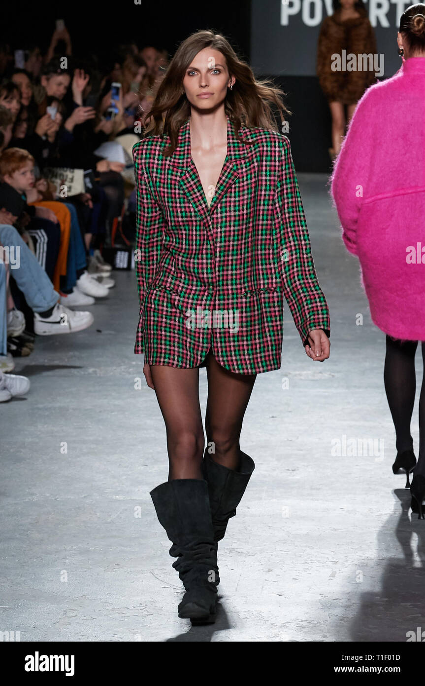 Modelst walking on the catwalk during the Fashion Fighting for Poverty ...