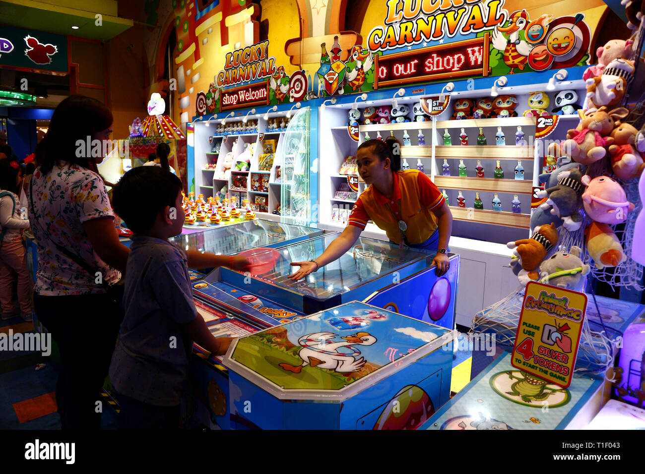 QUEZON CITY, PHILIPPINES - MARCH 24, 2019: Customers try different ...