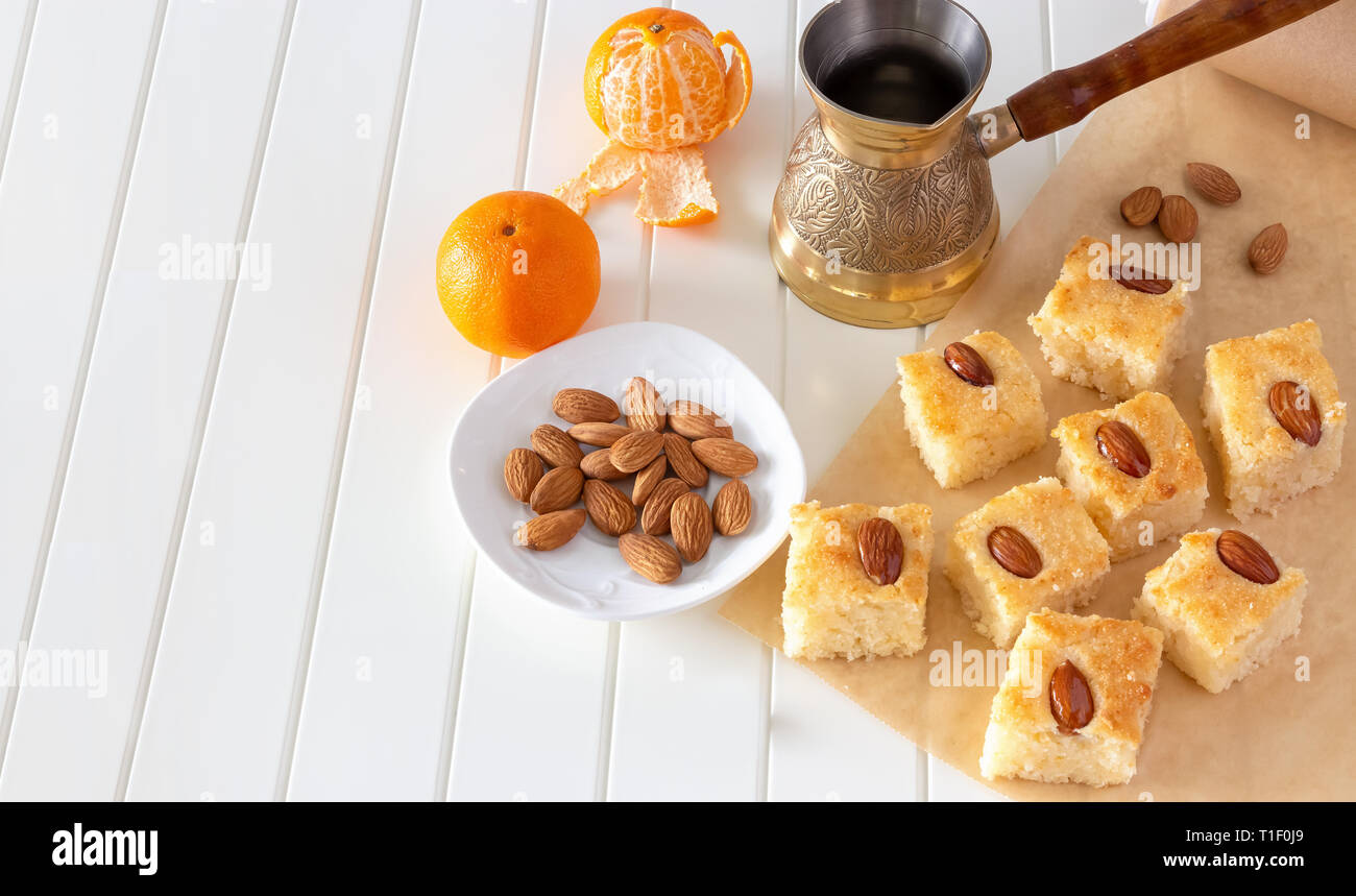 Pieces Basbousa (namoora) traditional arabic semolina cake with almond ...
