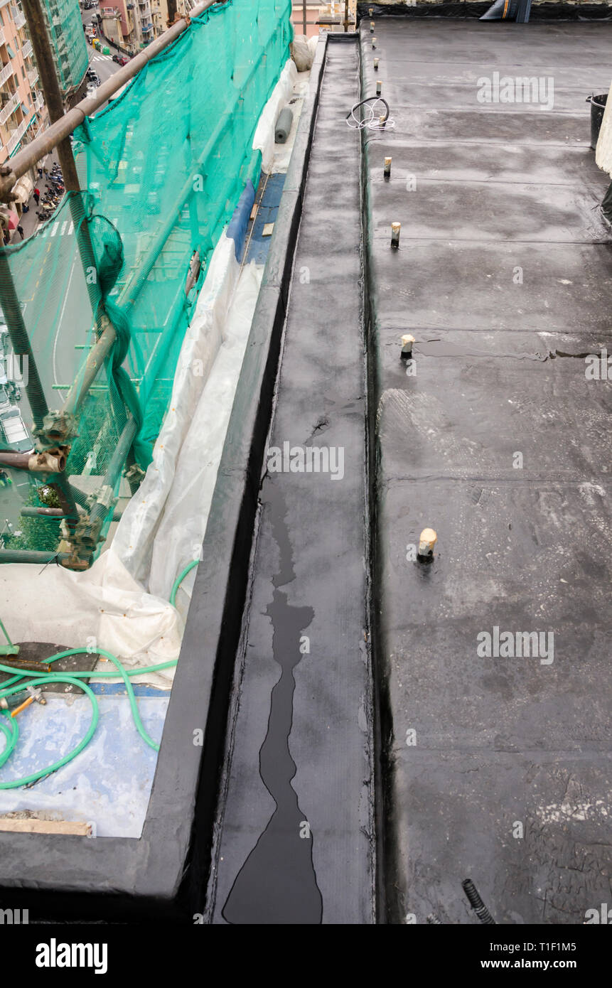 construction work during the renovation of a roof of a building with ...