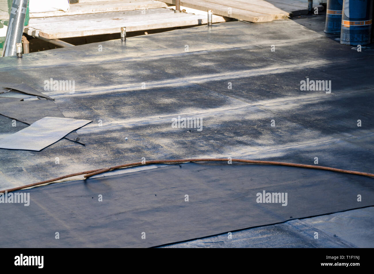 construction work during the renovation of a roof of a building with ...