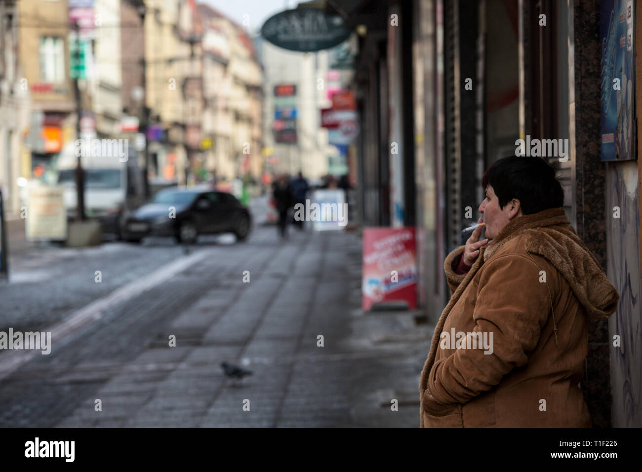28.02.2018, Bytom, Silesia, Poland - Woman downtown smoking cigarette ...