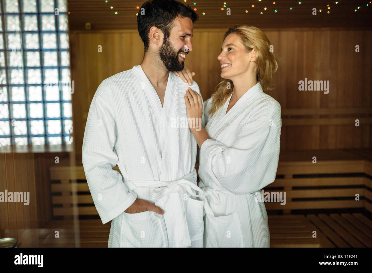 Attractive happy couple relaxing in spa center Stock Photo - Alamy