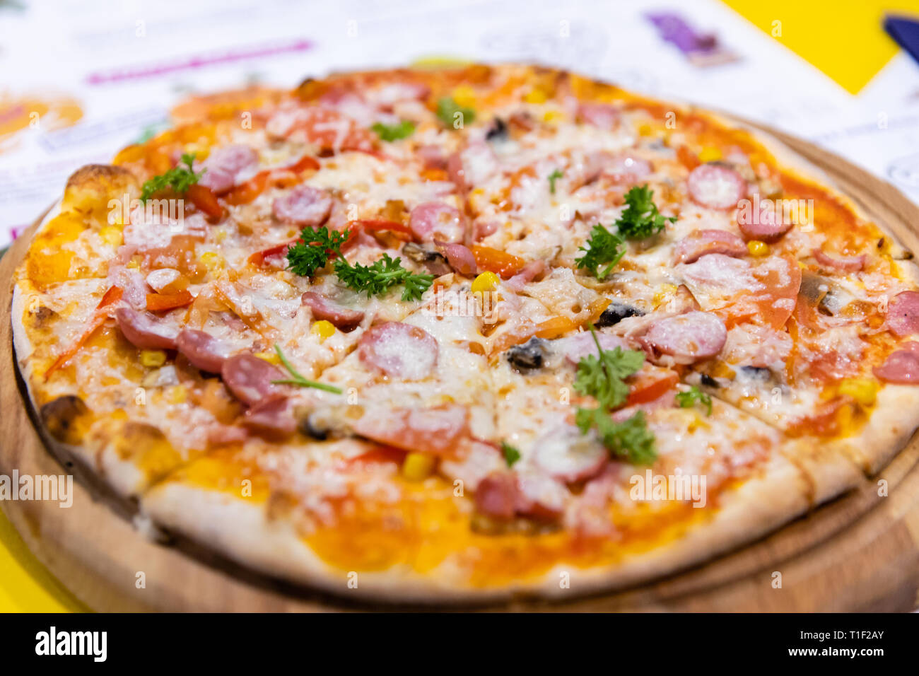 Hot pizza on the table in restaurant Stock Photo - Alamy