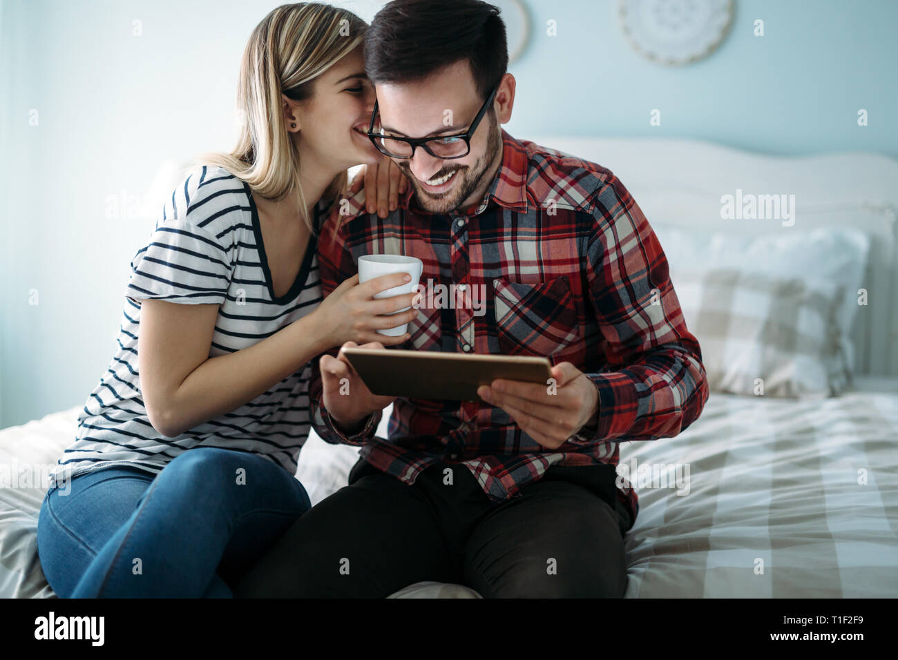 Couple in bedroom shopping hi-res stock photography and images - Alamy