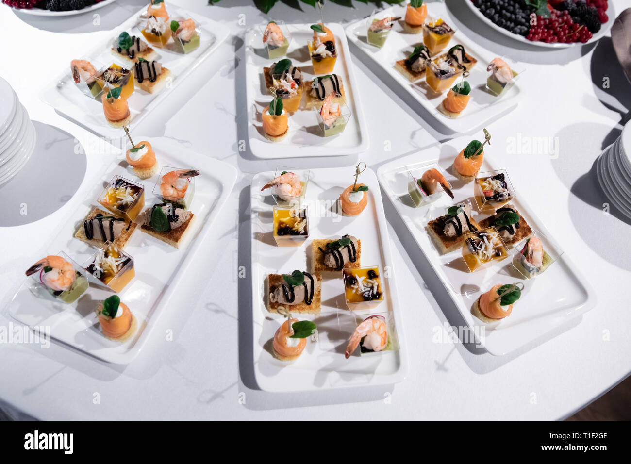 Canapes snacks for furshet on the plate in the restaurant Stock Photo ...