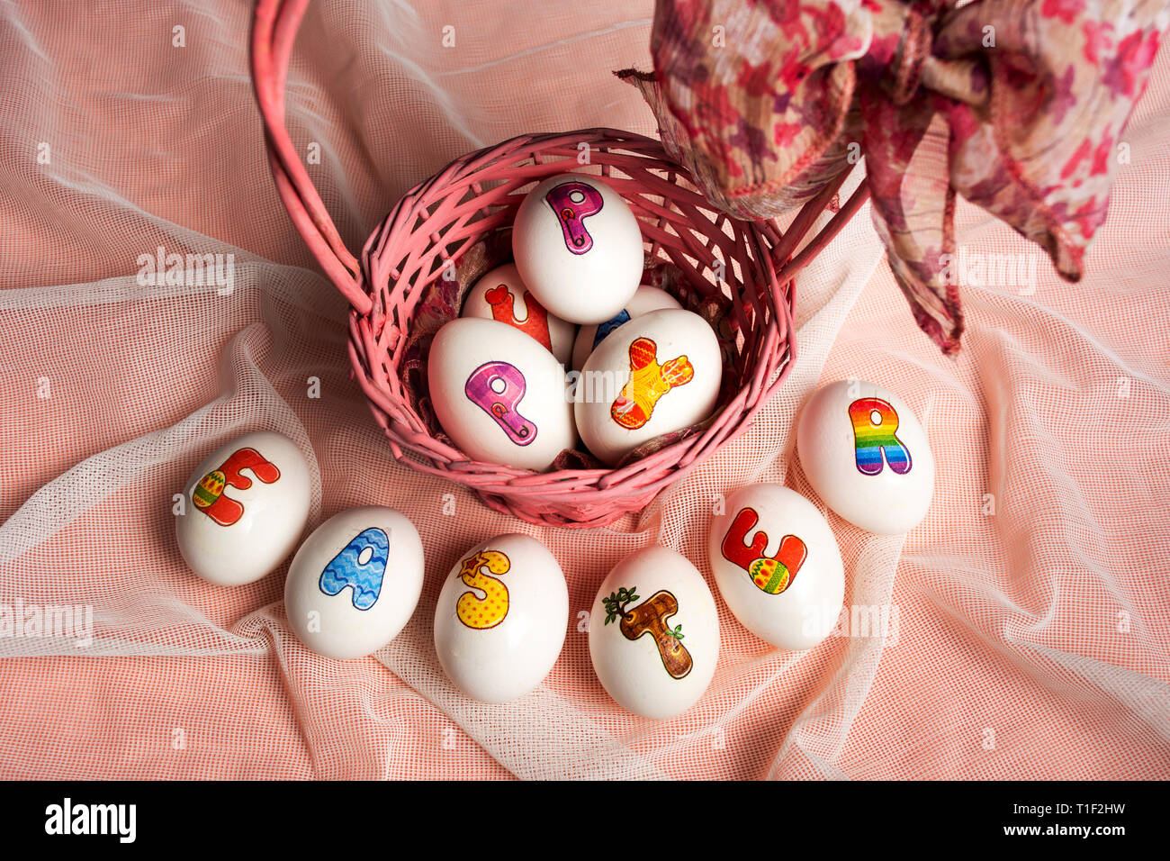 Decorated Easter eggs in a basket top view Stock Photo - Alamy
