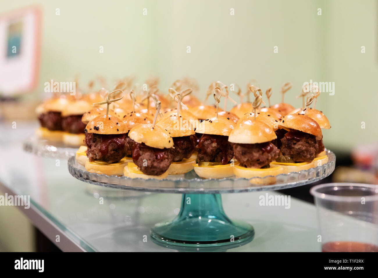 Mini burgers canapes snacks for furshet on the plate Stock Photo - Alamy