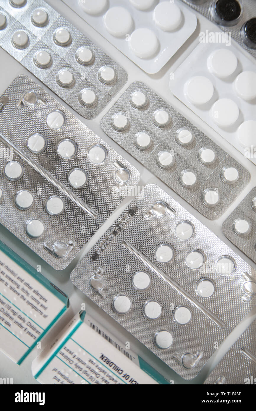 packaged pharmaceutical pills on a white background Stock Photo - Alamy