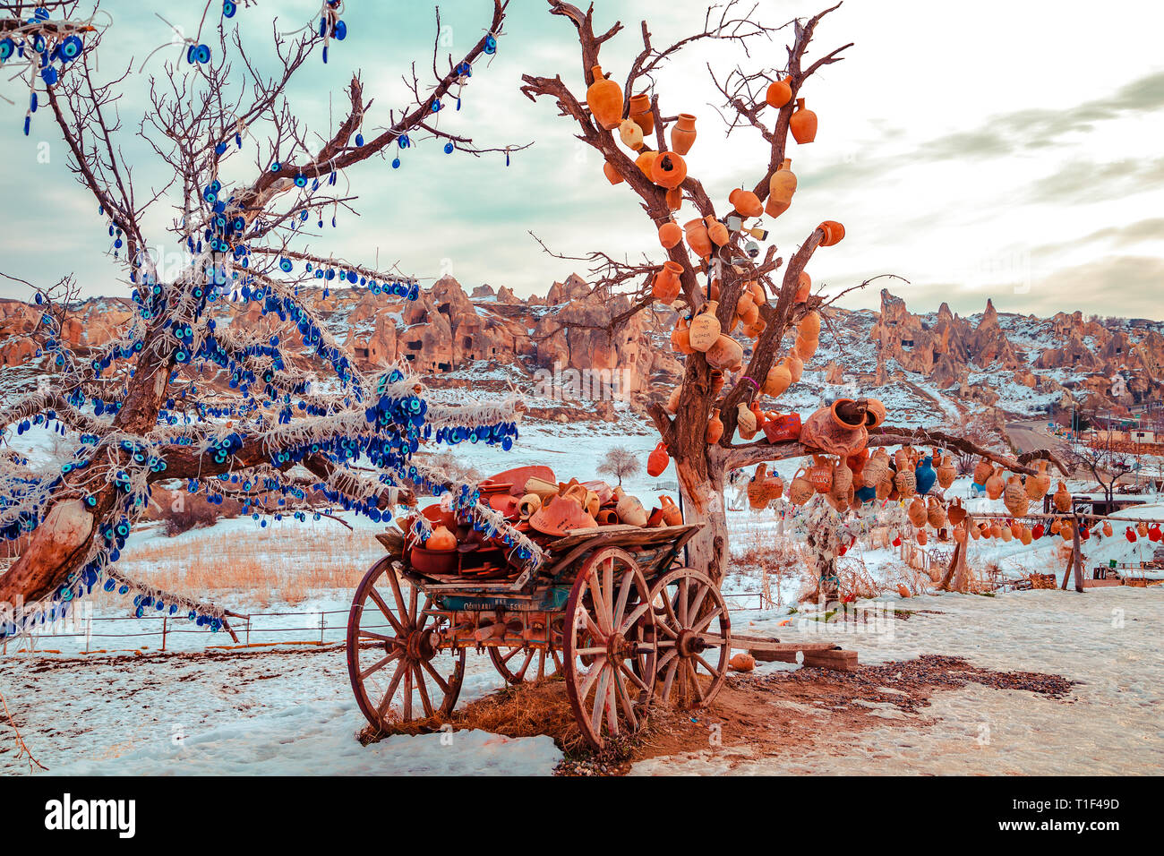 Decorative jugs on a tree and an old cart. Cappadocia, Turkey - January ...