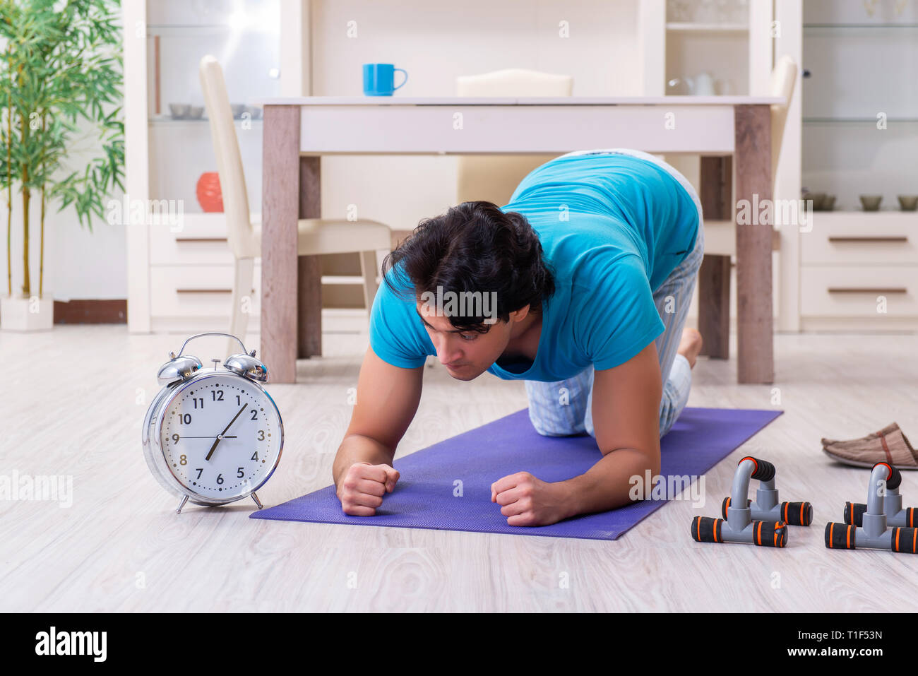 Young handsome man doing morning exercises Stock Photo - Alamy