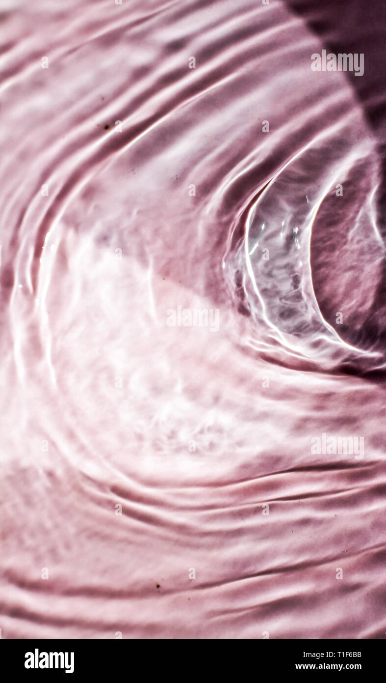 Pink flowing water texture as an abstract background - colourful ...