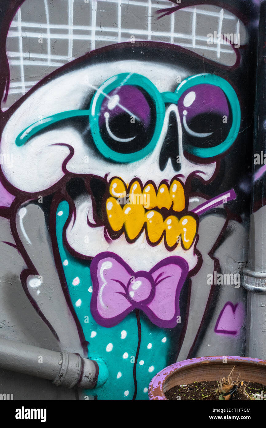 Day of the Dead art, Skull graffiti on a pub wall in Camden, London ...