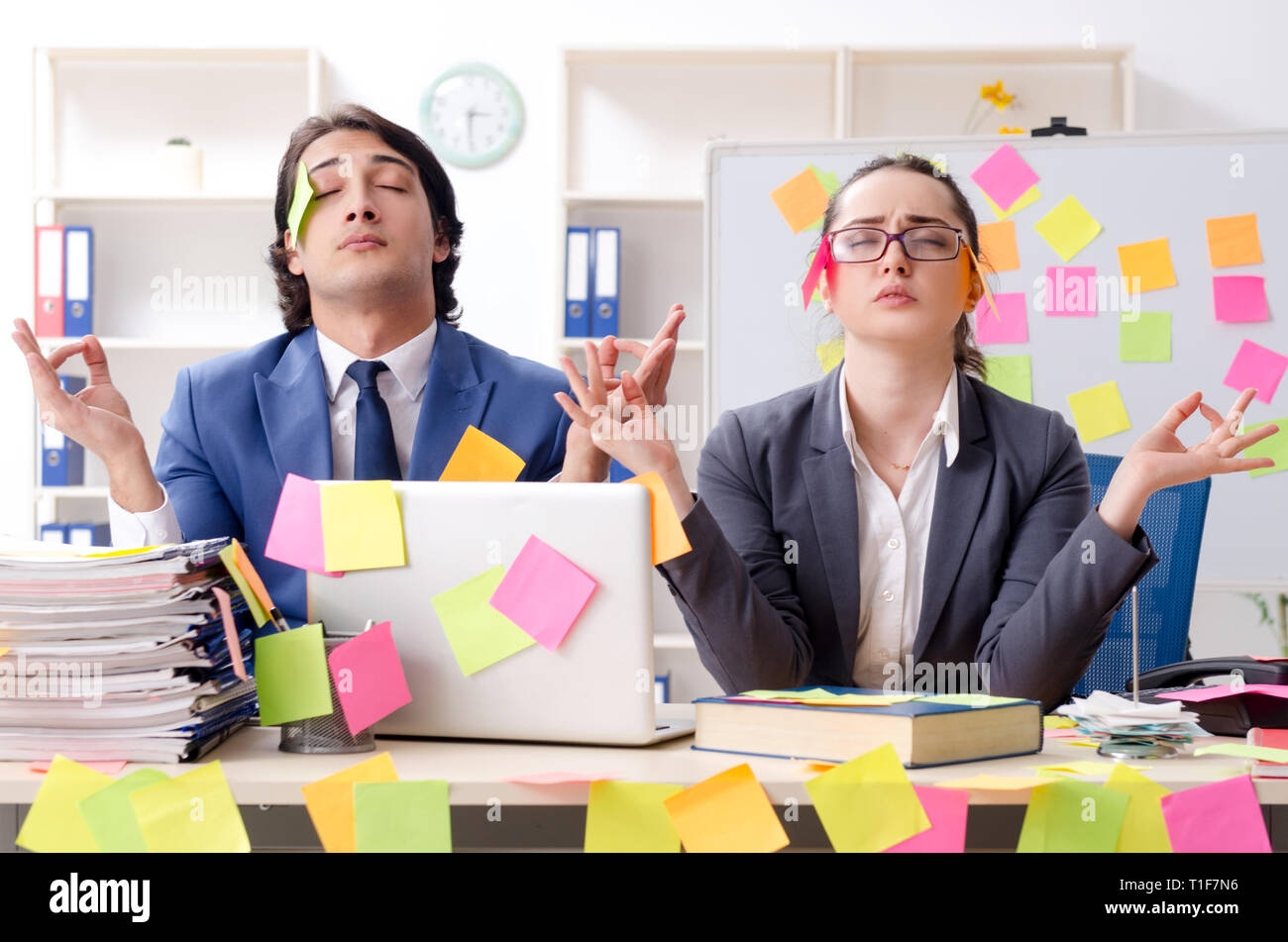 Two colleagues employees working in the office Stock Photo - Alamy