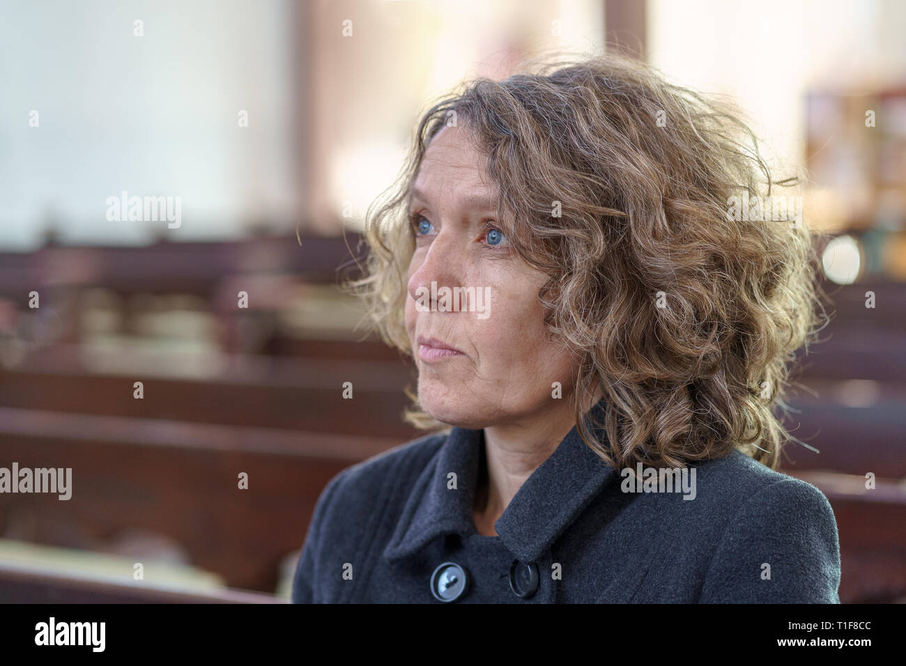 Pious expression hi-res stock photography and images - Alamy