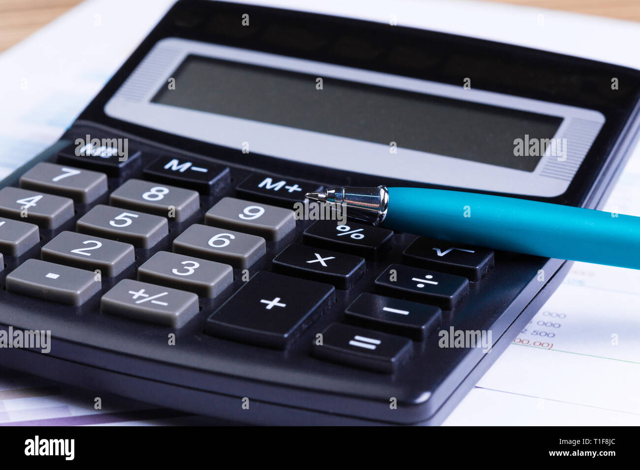 Graphs and Calculator Stock Photo - Alamy