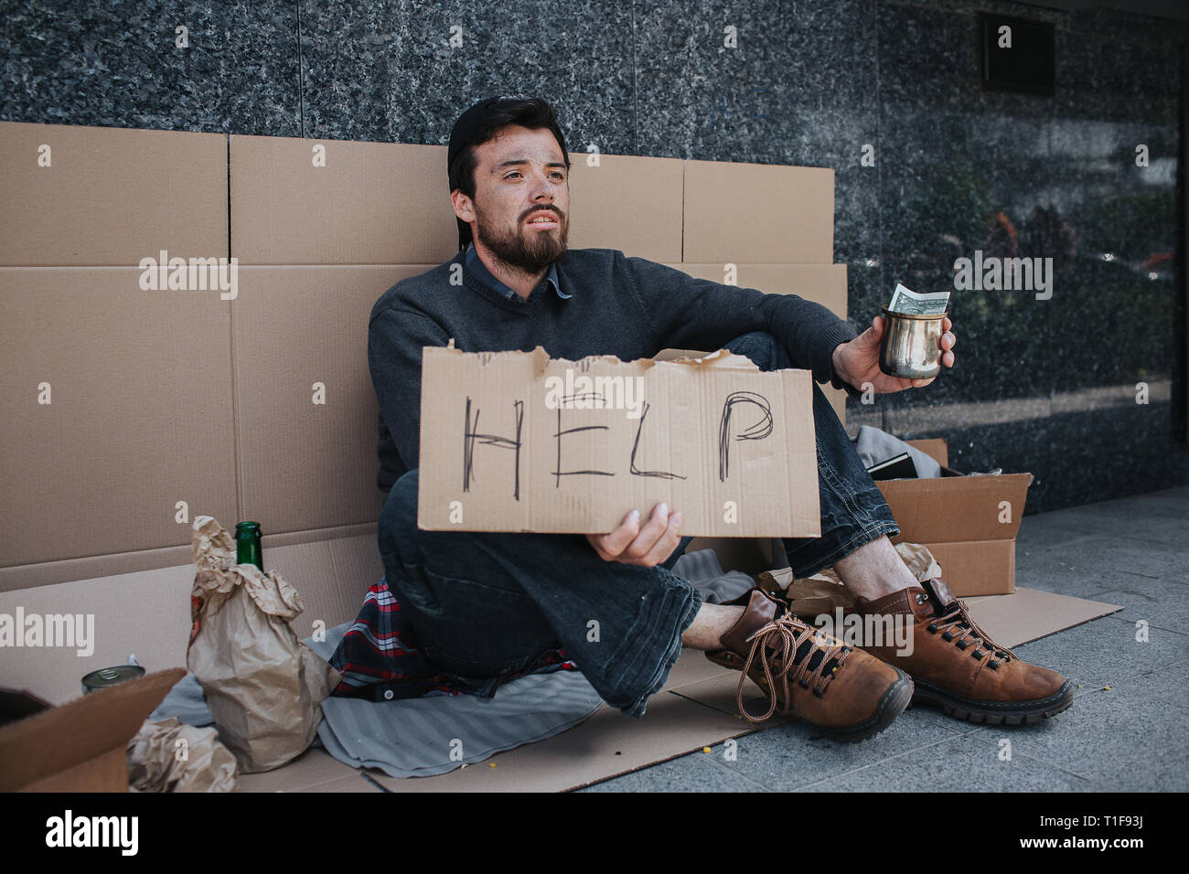 Homeless man holding cardboard sign hi-res stock photography and images ...